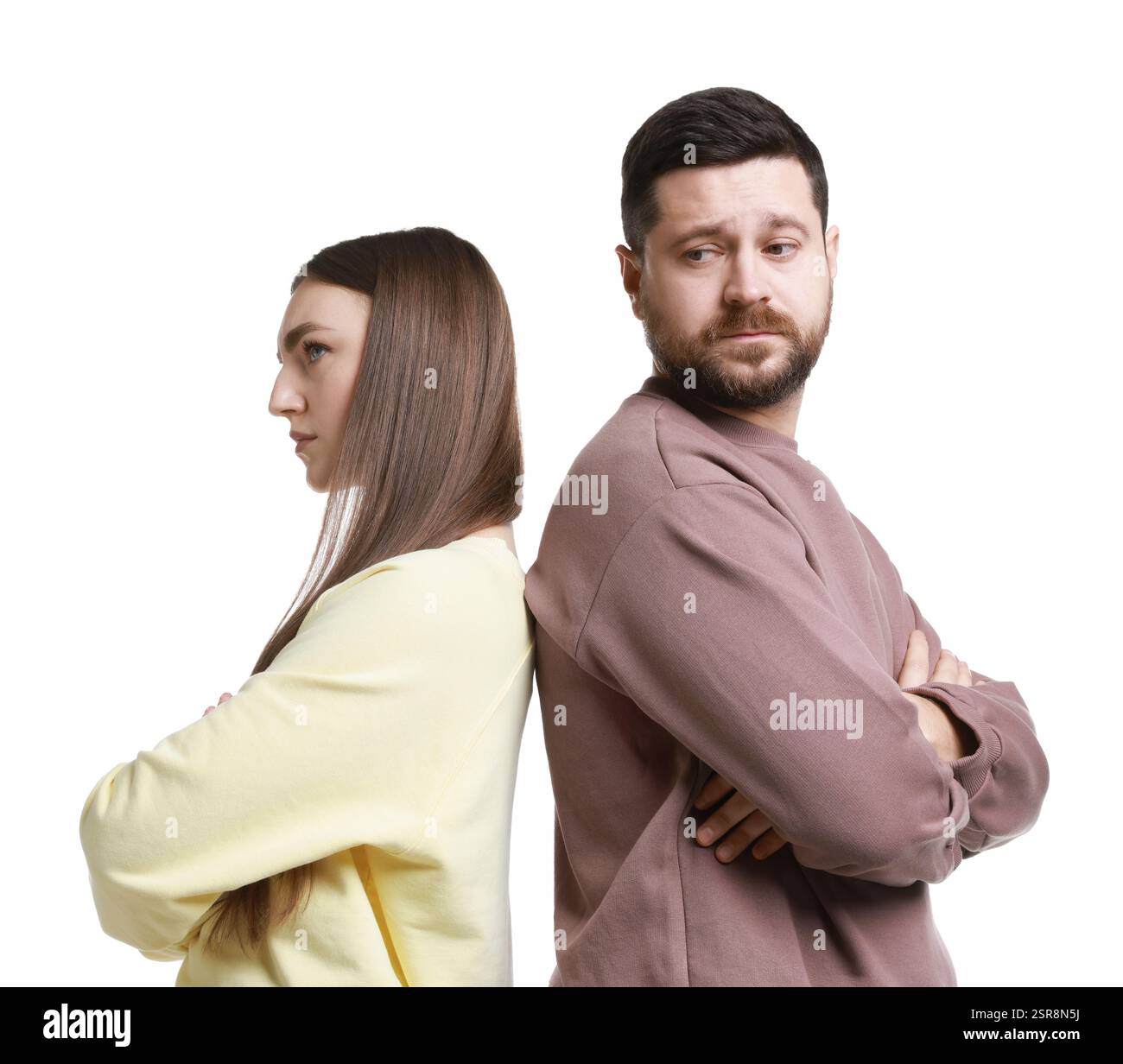 Resentful couple with crossed arms on white background Stock Photo - Alamy