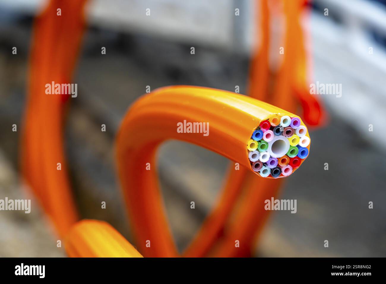 Empty conduits for fibre optic cables, protective conduit in orange ...