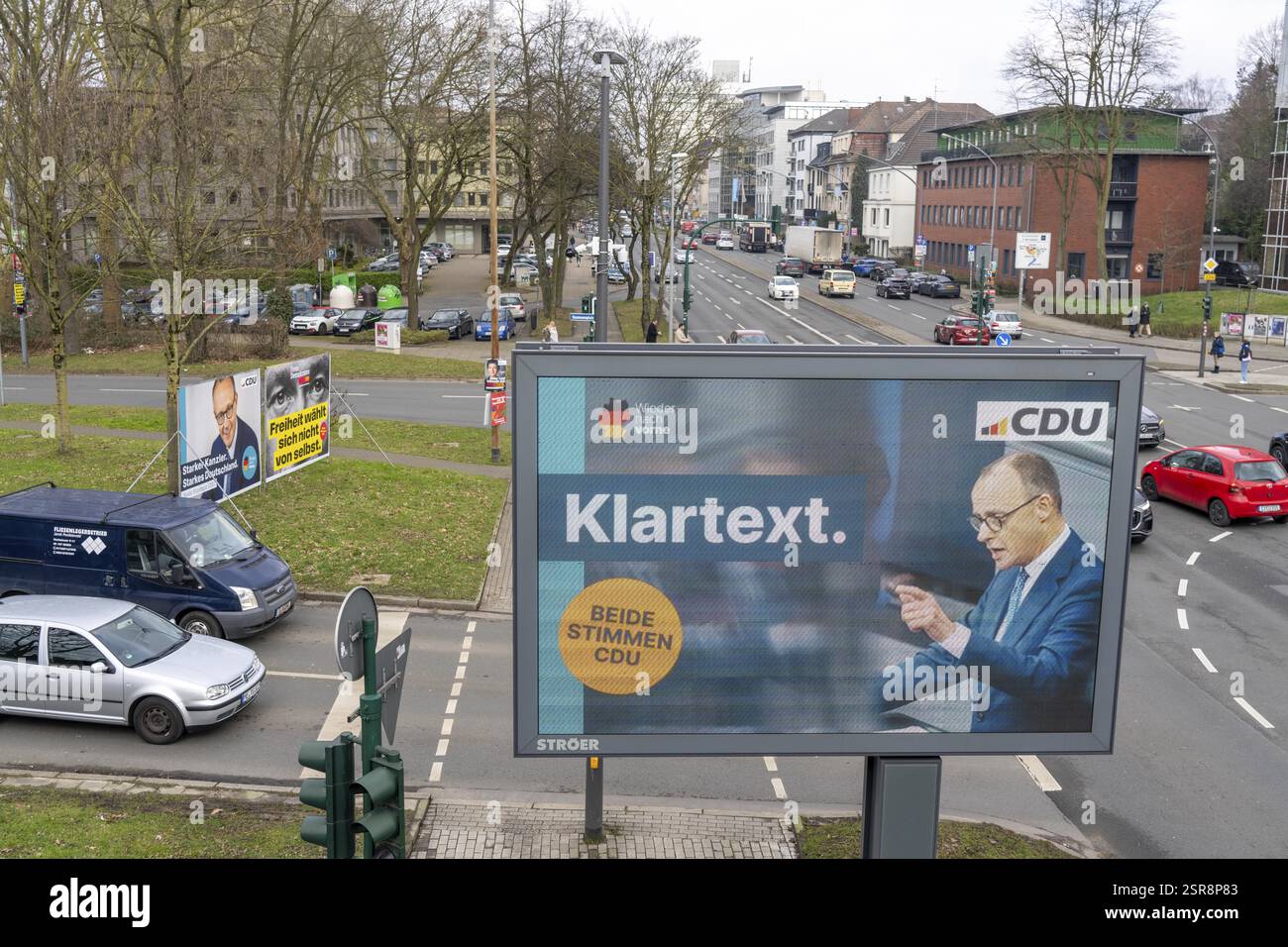 Digital billboard with CDU election advertising, behind it analogue ...