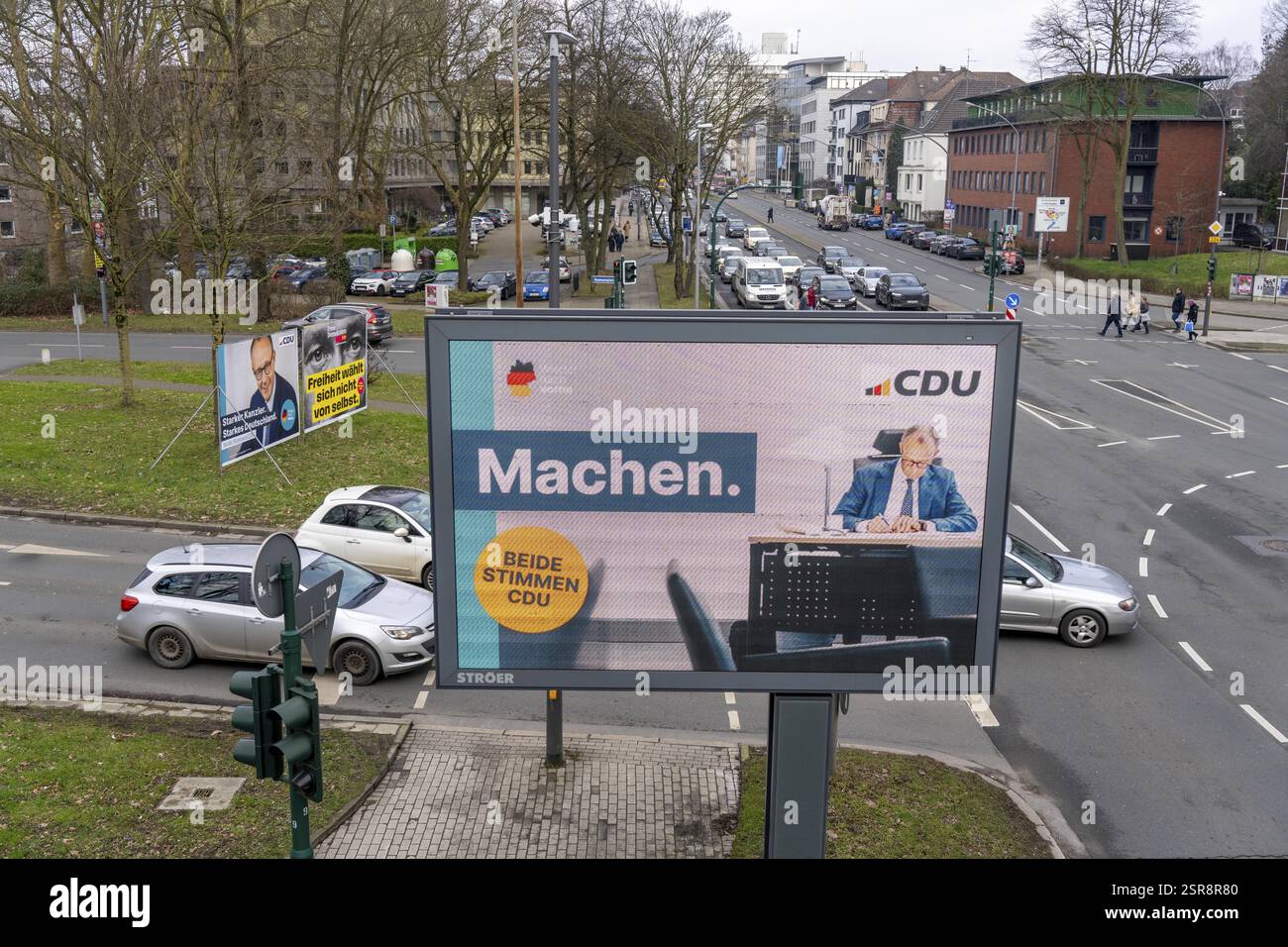 Digital billboard with CDU election advertising, behind it analogue ...