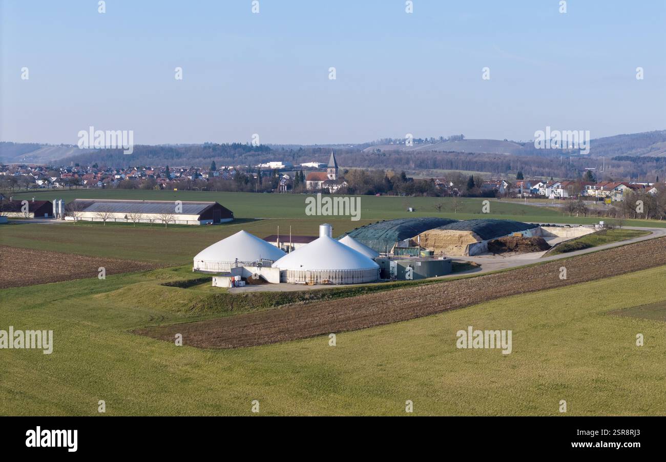 Panorama of a biogas plant on a hill in an extensive landscape with a ...