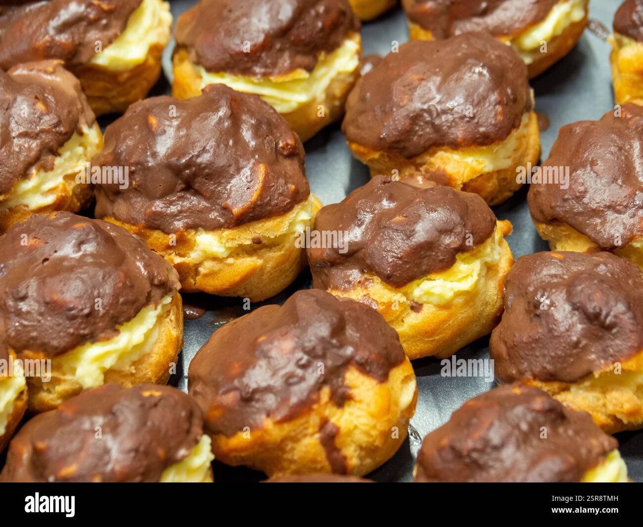 mini homemade chocolate eclairs cake dessert Stock Photo - Alamy