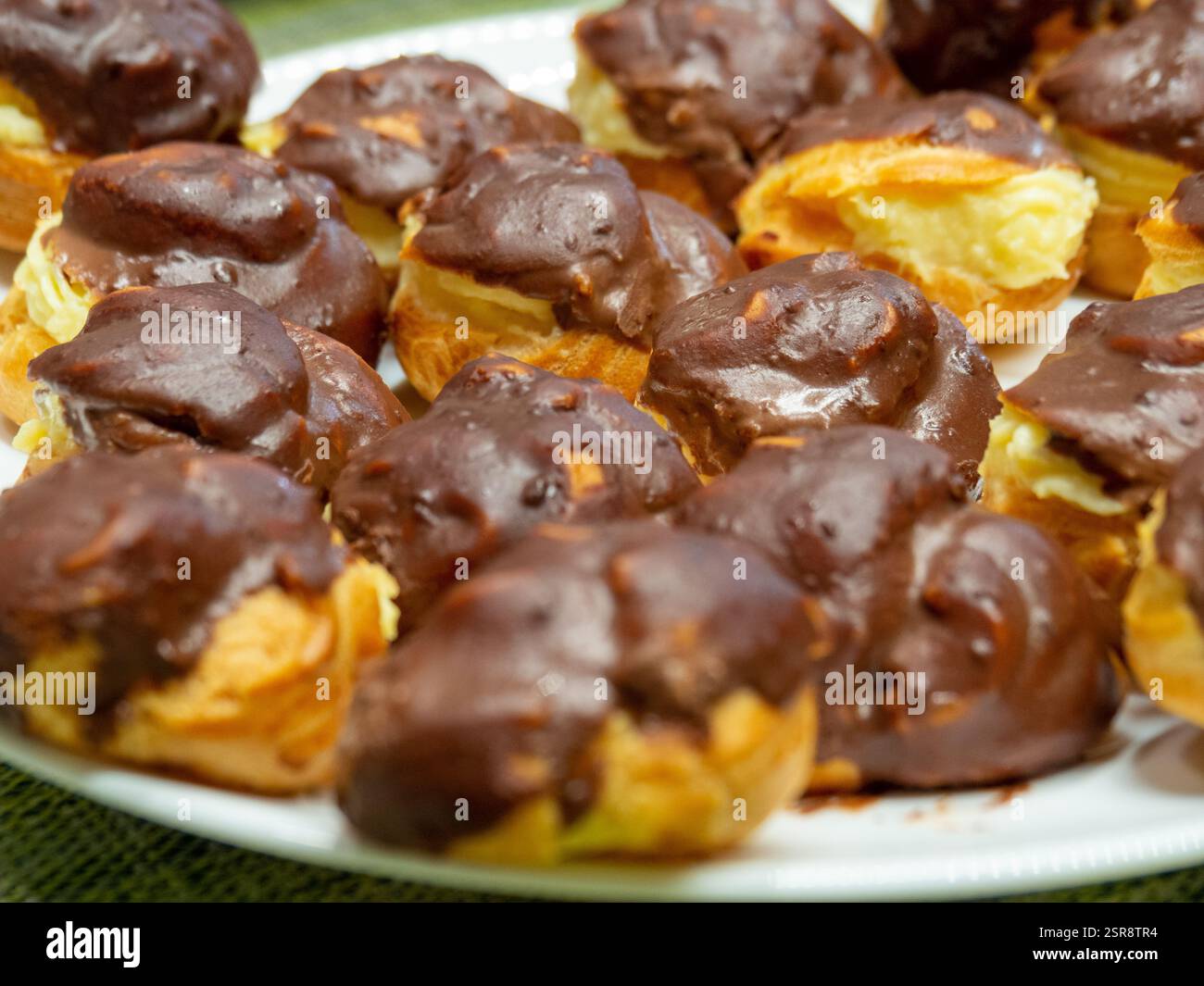 mini homemade chocolate eclairs cake dessert Stock Photo - Alamy