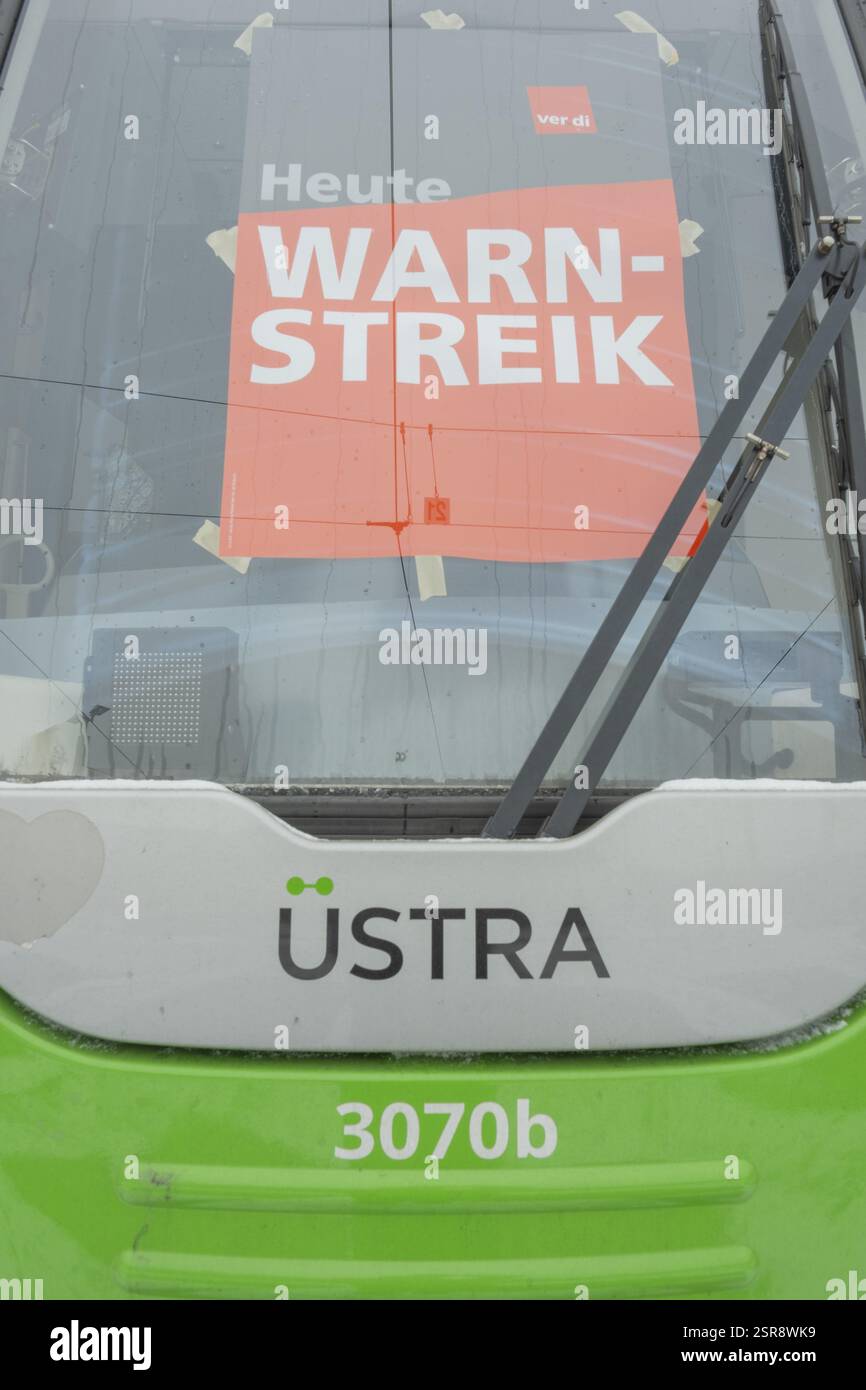 View of an Uestra TW 3000 train with a strike poster stuck to the ...