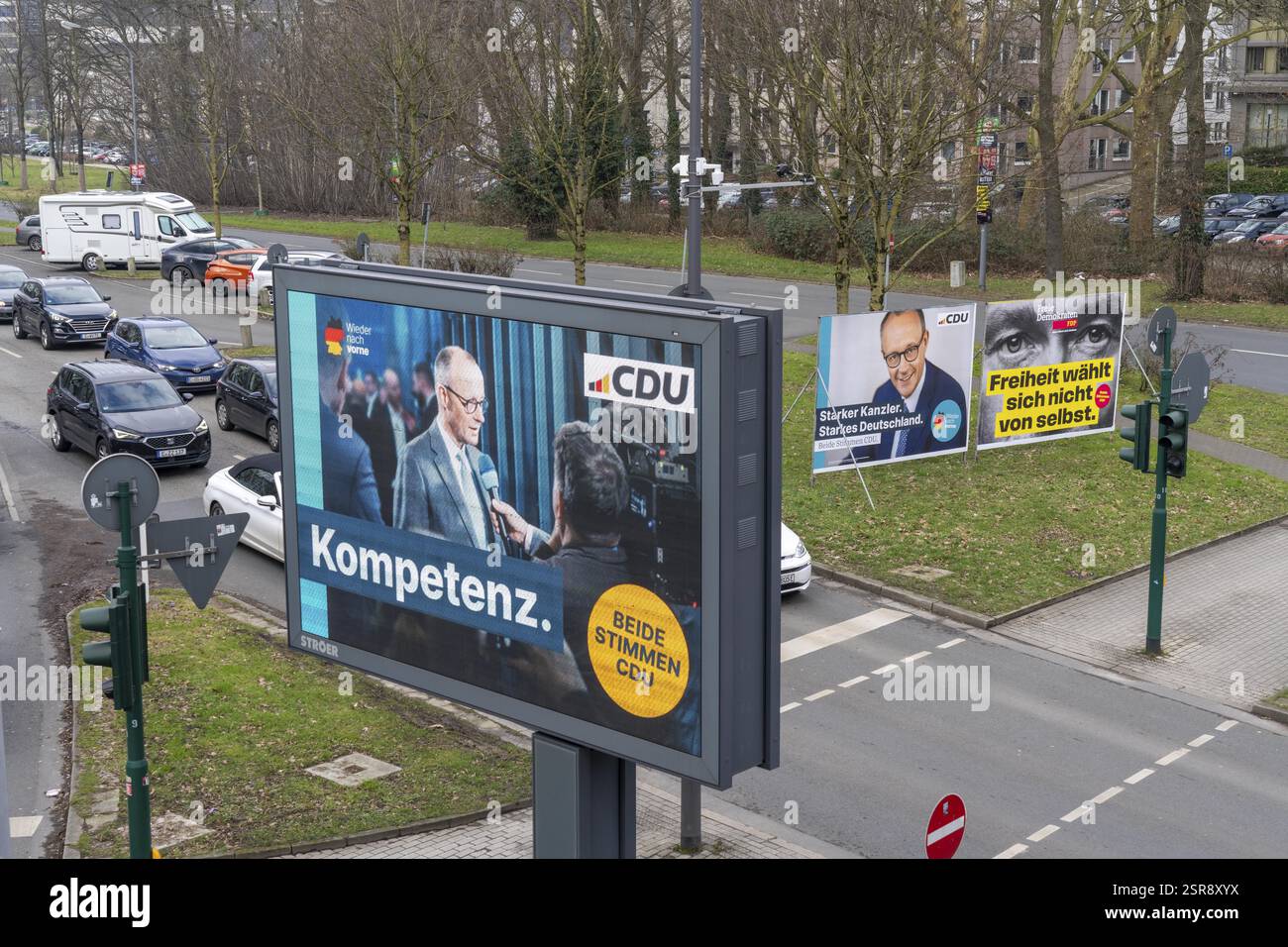 Digital billboard with CDU election advertising, behind it analogue ...