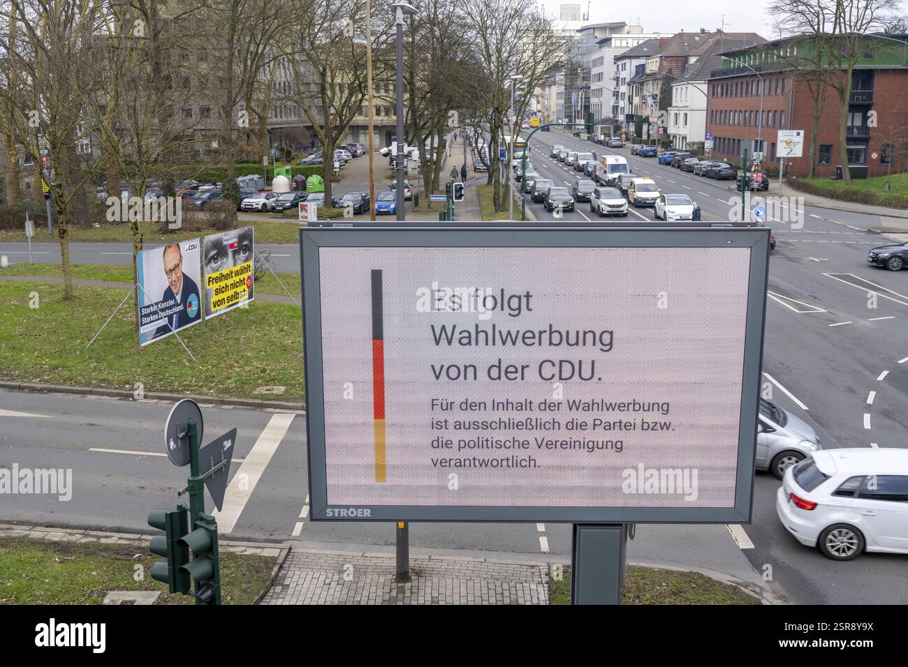 Digital billboard with CDU election advertising, behind it analogue ...