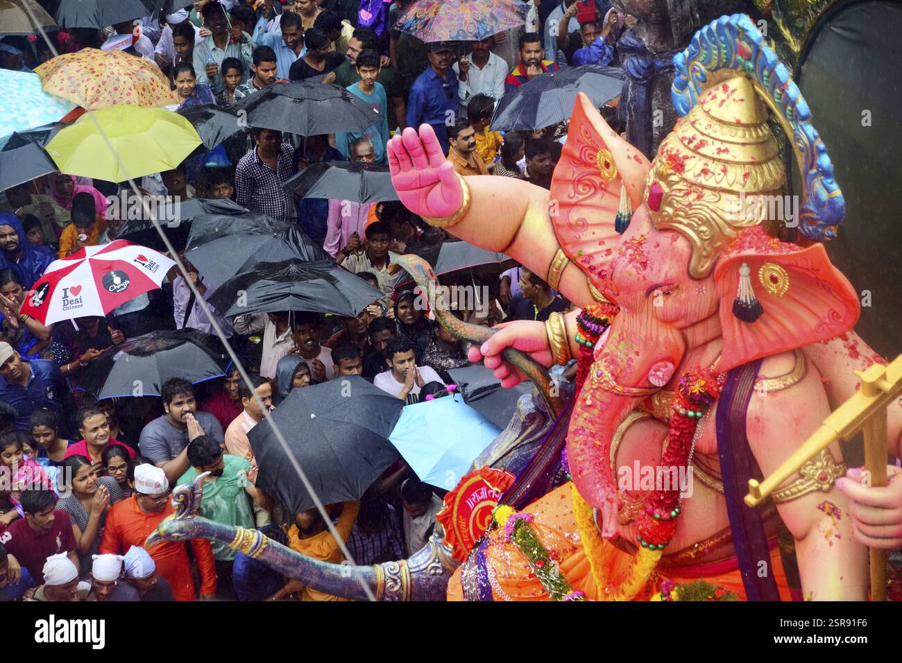 A gigantic idol of Hindu elephant-headed god Ganesh, being led to the ...