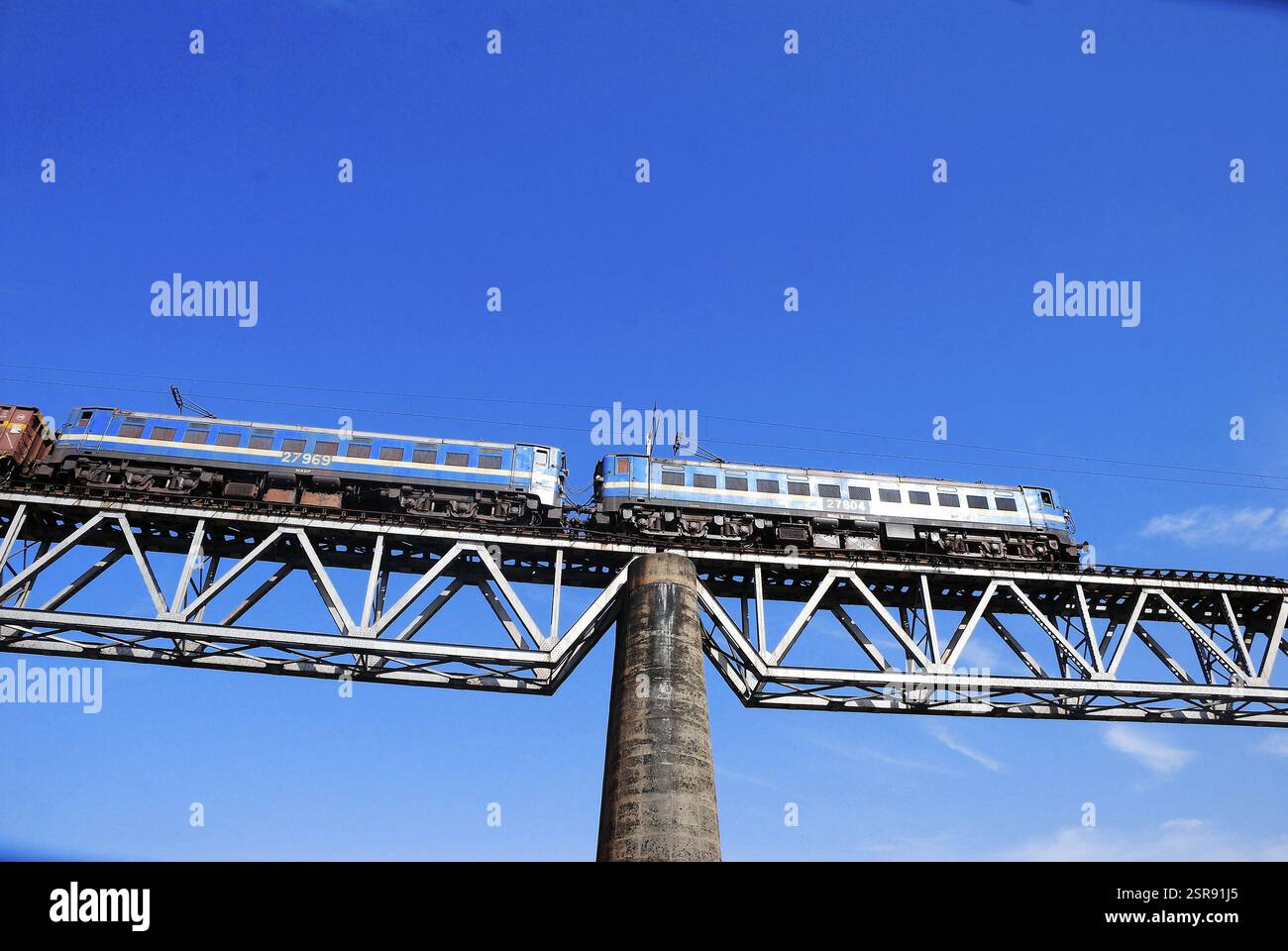 Multiply electric locomotive carrying freight train on bridge, Calcutta ...