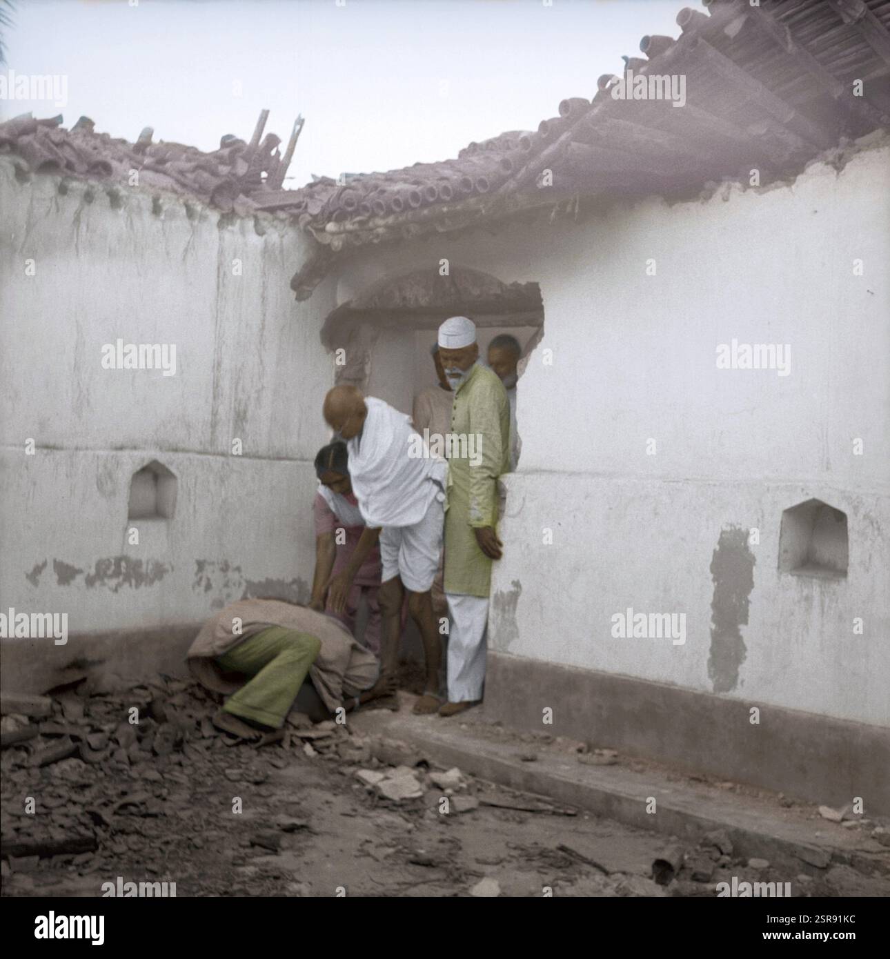 Woman crying at feet of Mahatma Gandhi during peace march, Bihar, India ...