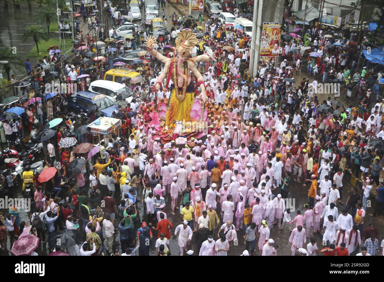 A gigantic idol of Hindu elephant-headed god Ganesh, being led to the ...