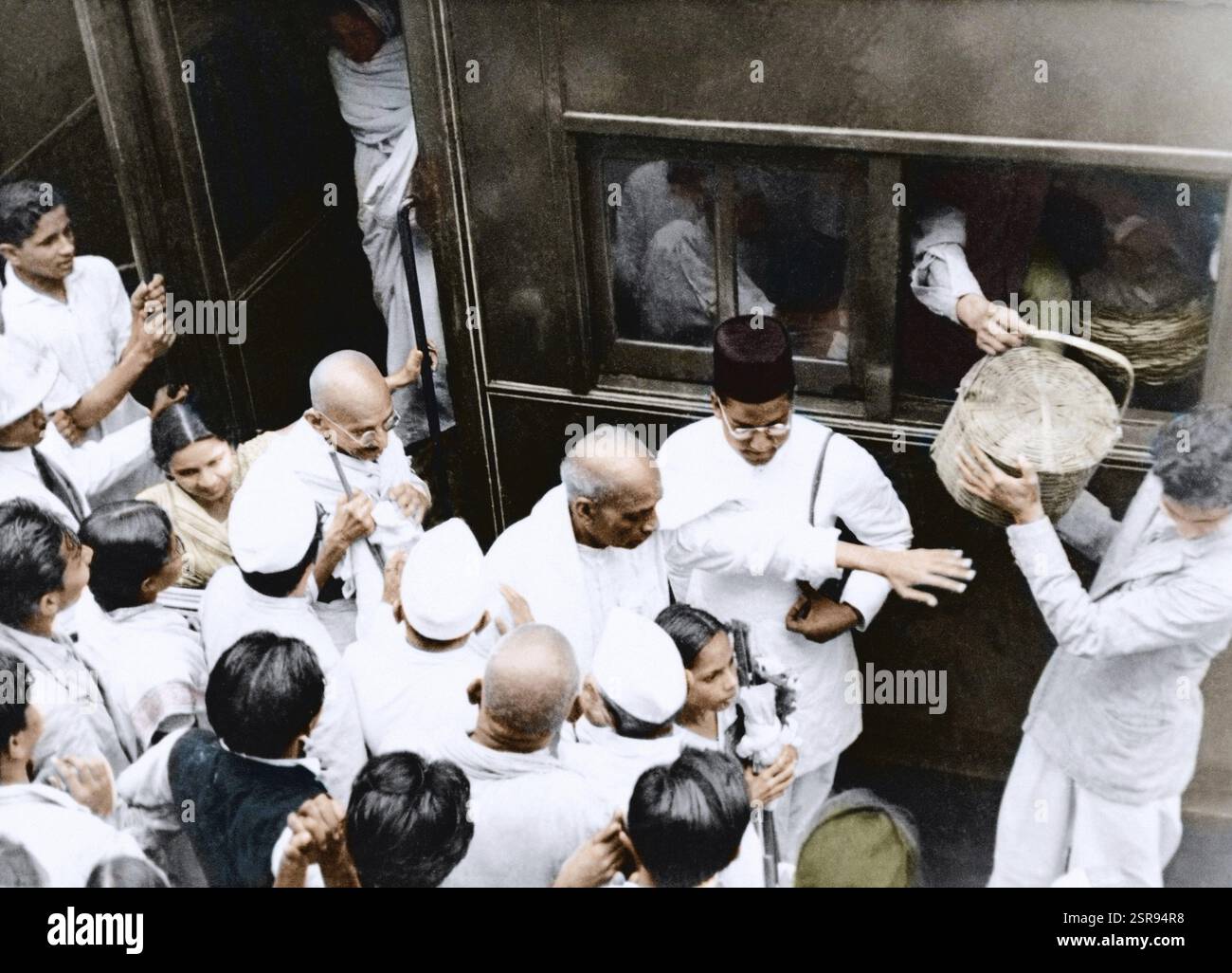 Sardar Vallabhbhai Patel receiving Mahatma Gandhi alighting from train ...