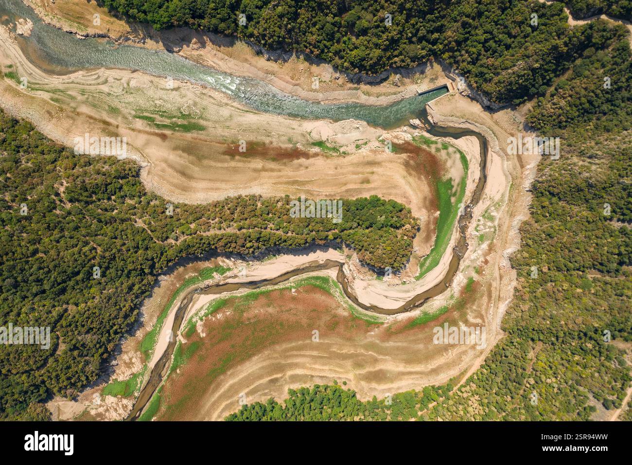 Dry tail meander of the Susqueda reservoir during the summer drought of ...