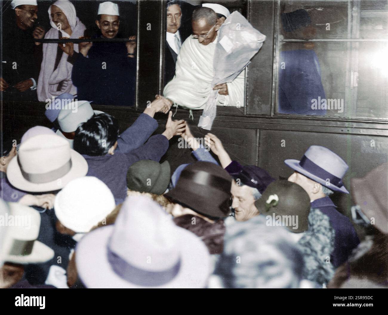 Mahatma Gandhi receiving farewell greeting at Lausanne station ...