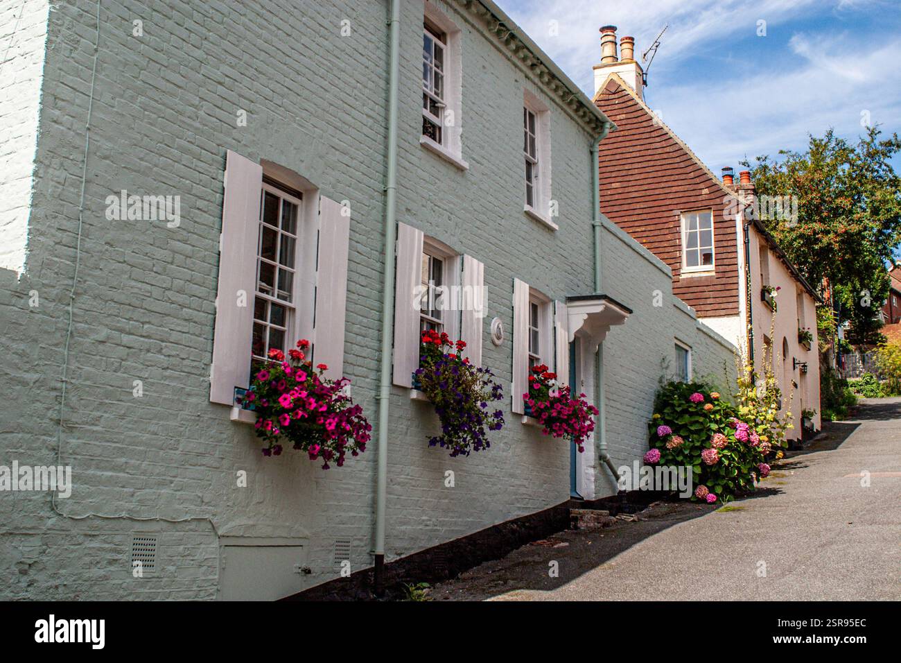 Cottages with window boxes & flowers in bloom on Church Hill, one of ...