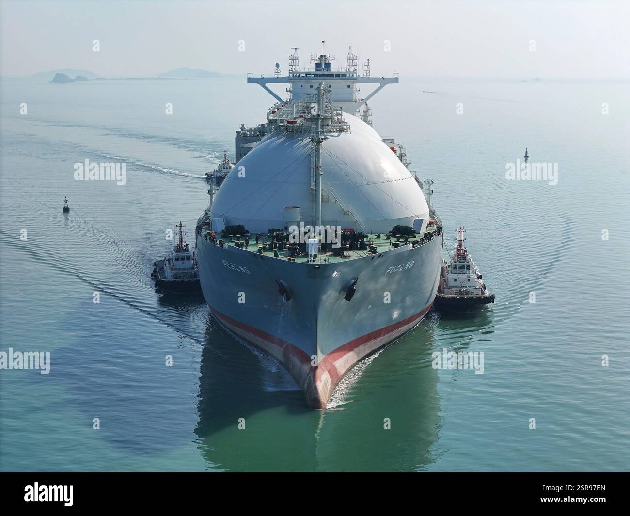 A Fuji LNG tanker sails into the port in Yantai in east China's ...