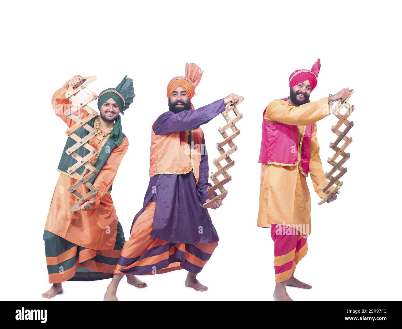 Dancers playing musical instrument performing folk dance bhangra MR ...