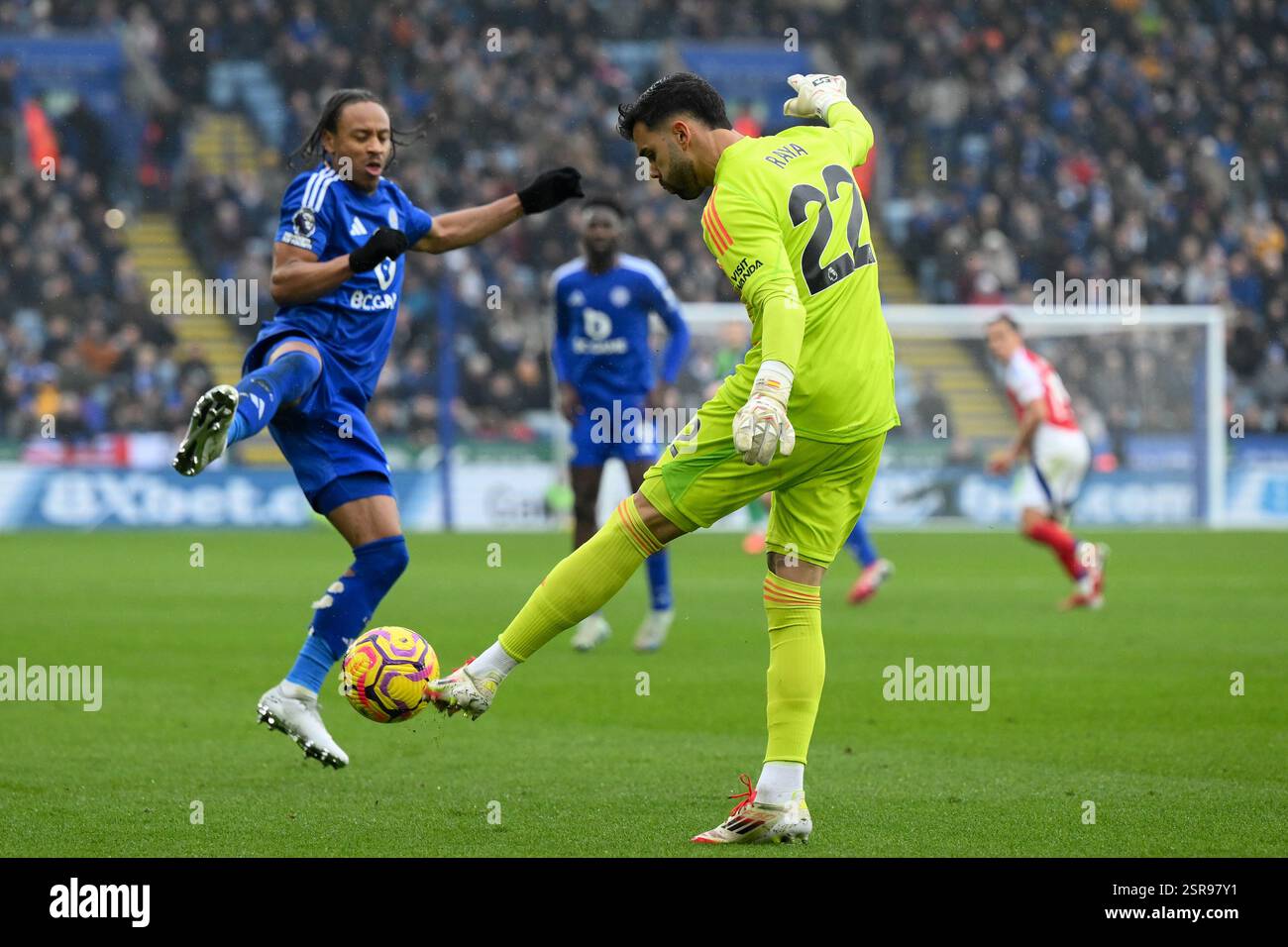 David Raya, Arsenal goalkeeper clears the ball under pressure from ...