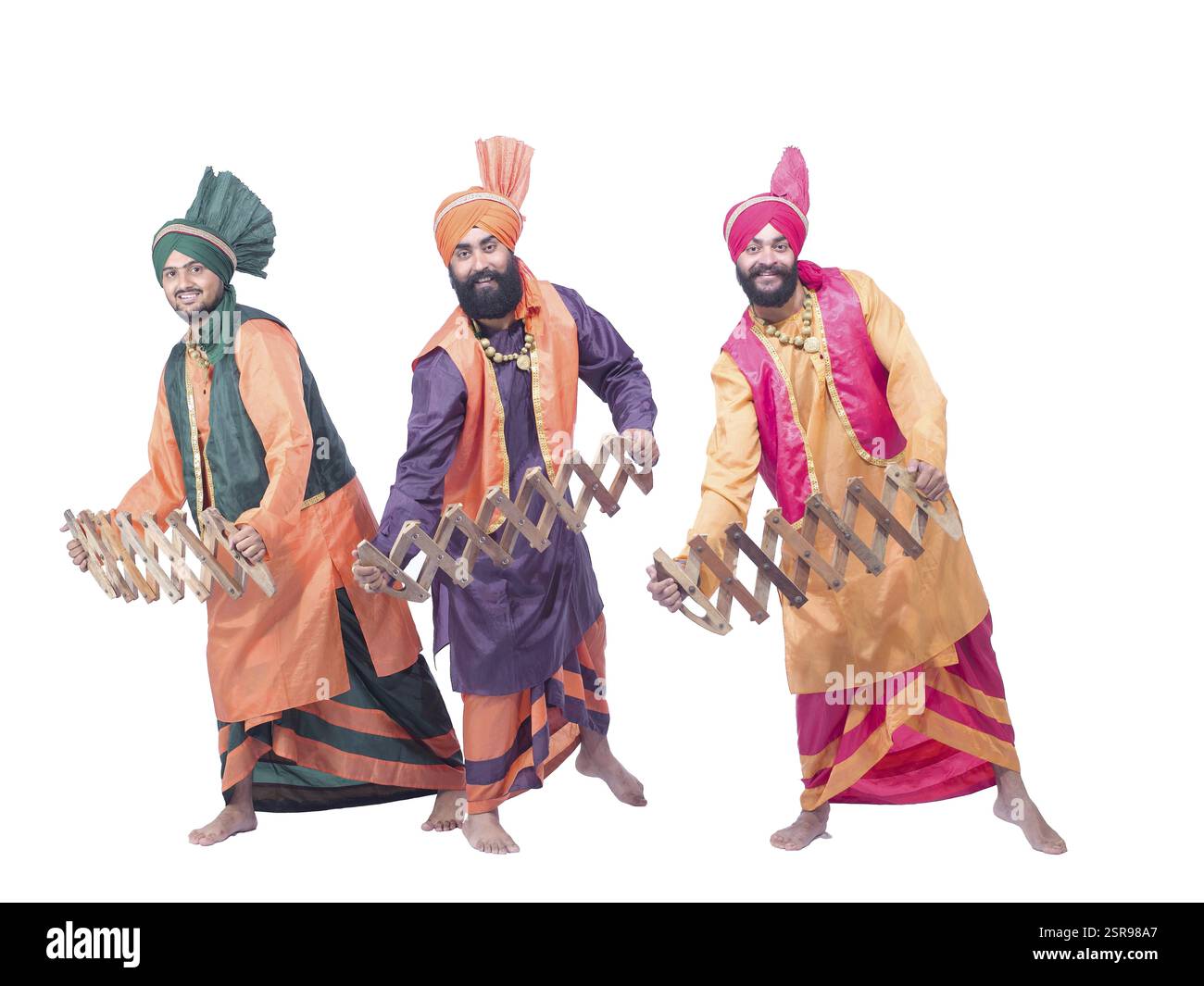 Dancers playing musical instrument performing folk dance bhangra MR ...