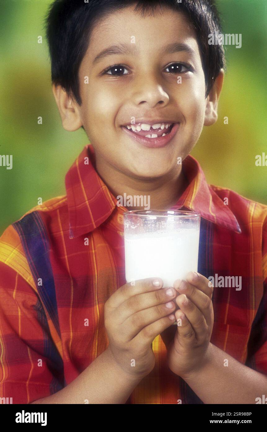 Child drinking milk, India MR#152 Stock Photo - Alamy