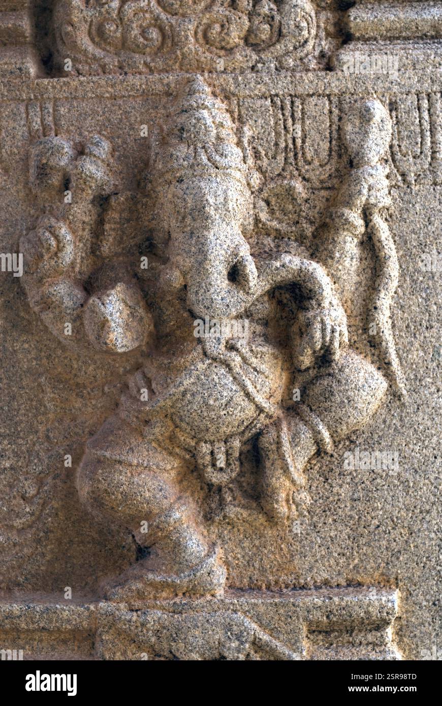 Dancing Ganesha holding snake on exterior wall of Ramachandra temple in ...