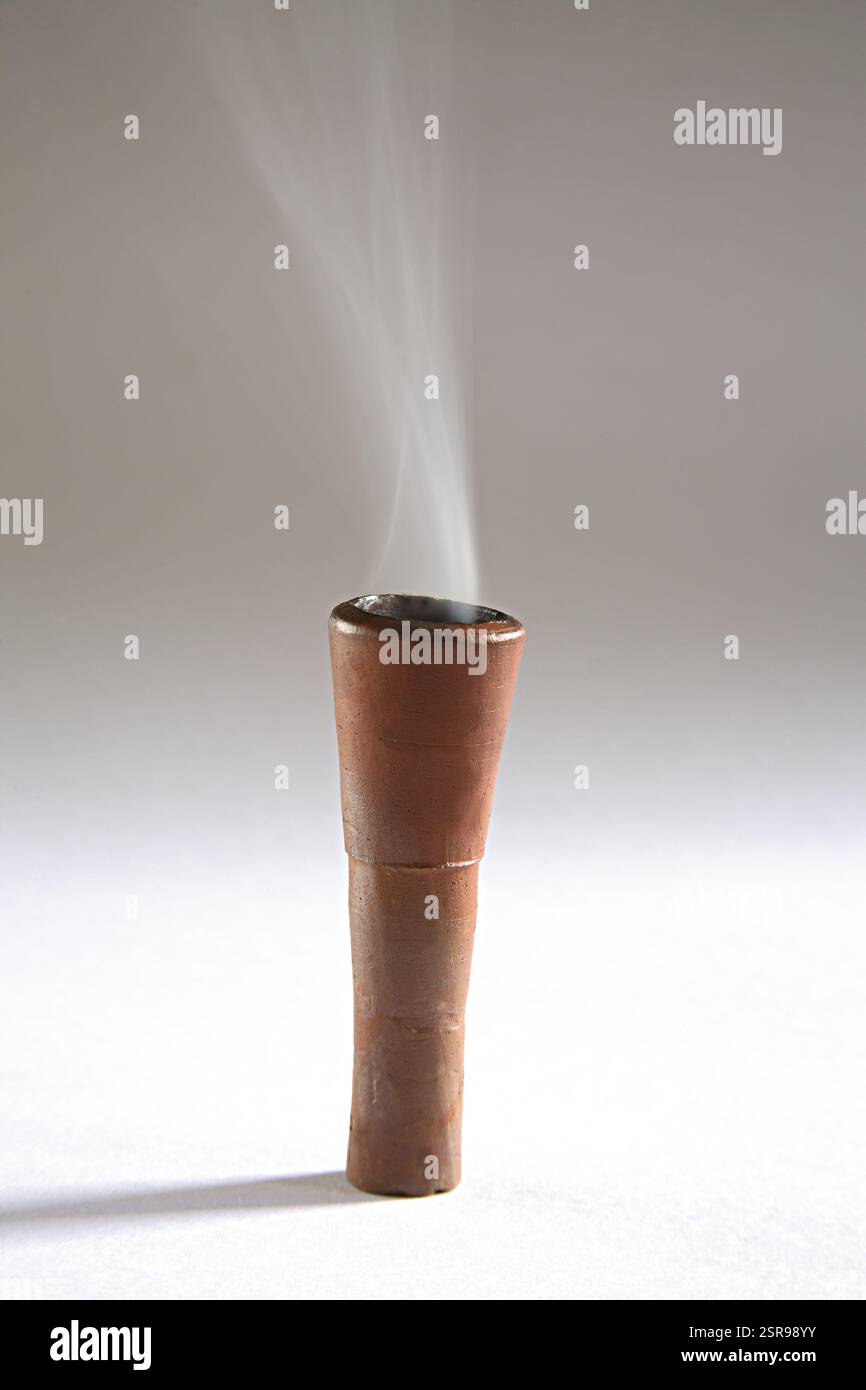 Concept, clay cilam contains fire and tobacco for smoke equipment on ...