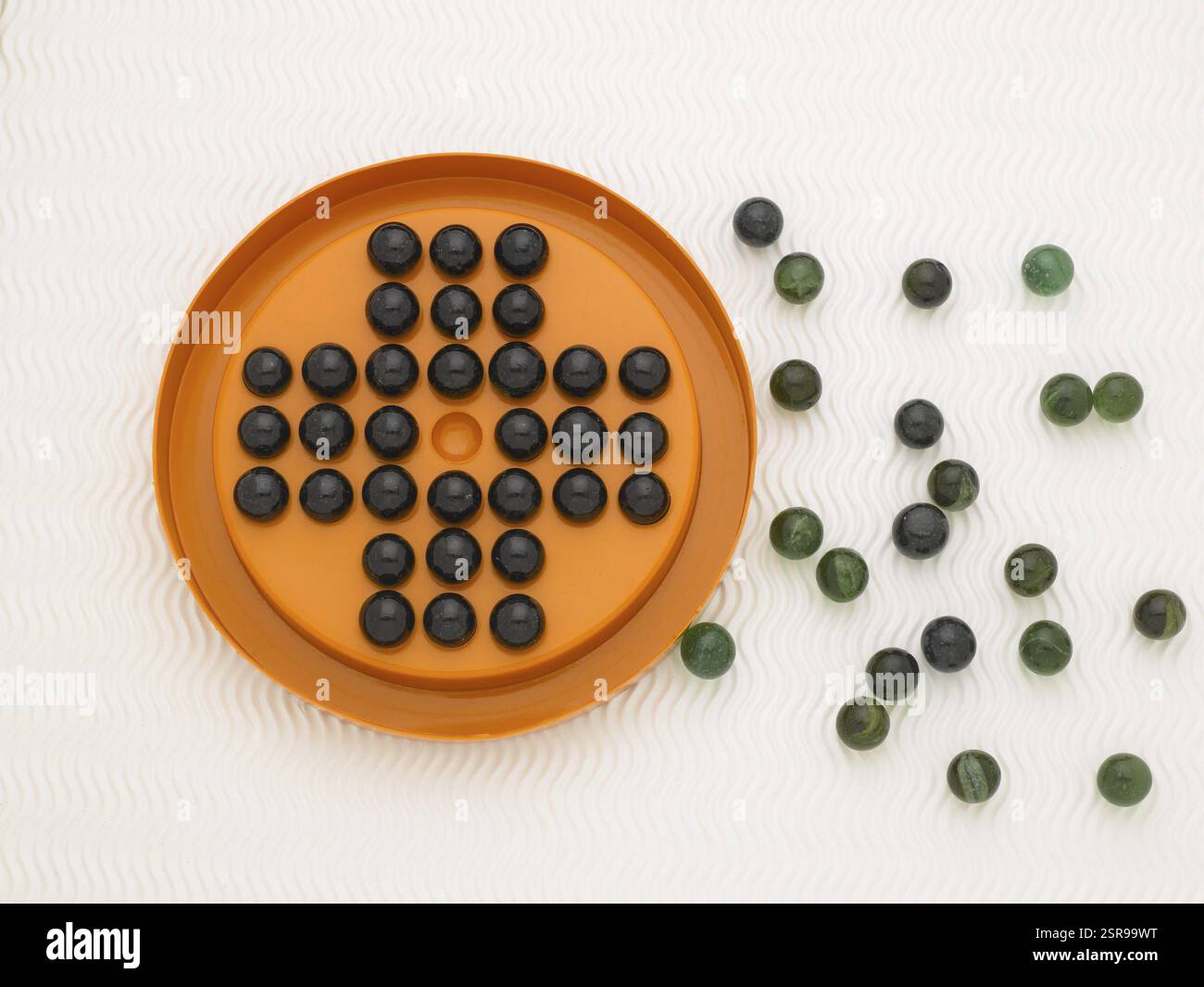 Marble solitaire game India Stock Photo - Alamy