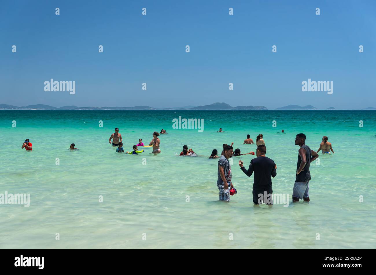Tourists enjoying turquoise Atlantic Ocean waters at Prainha beach ...