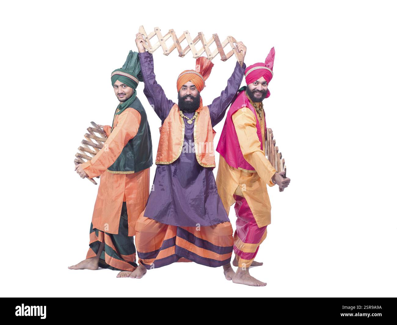 Dancers playing musical instrument performing folk dance bhangra MR ...