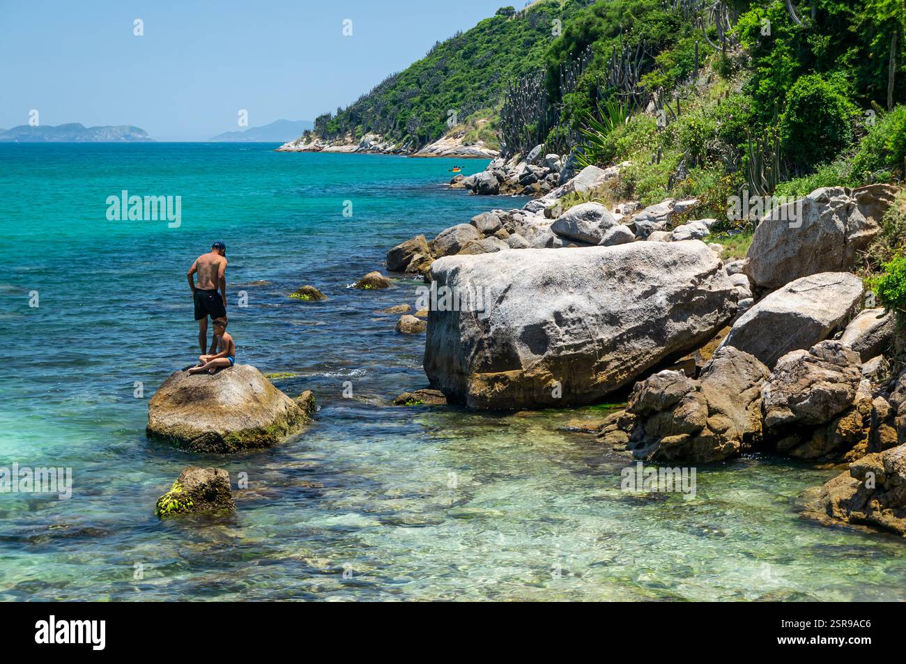 Prainha beach rock formations at the southeast end with tourists ...