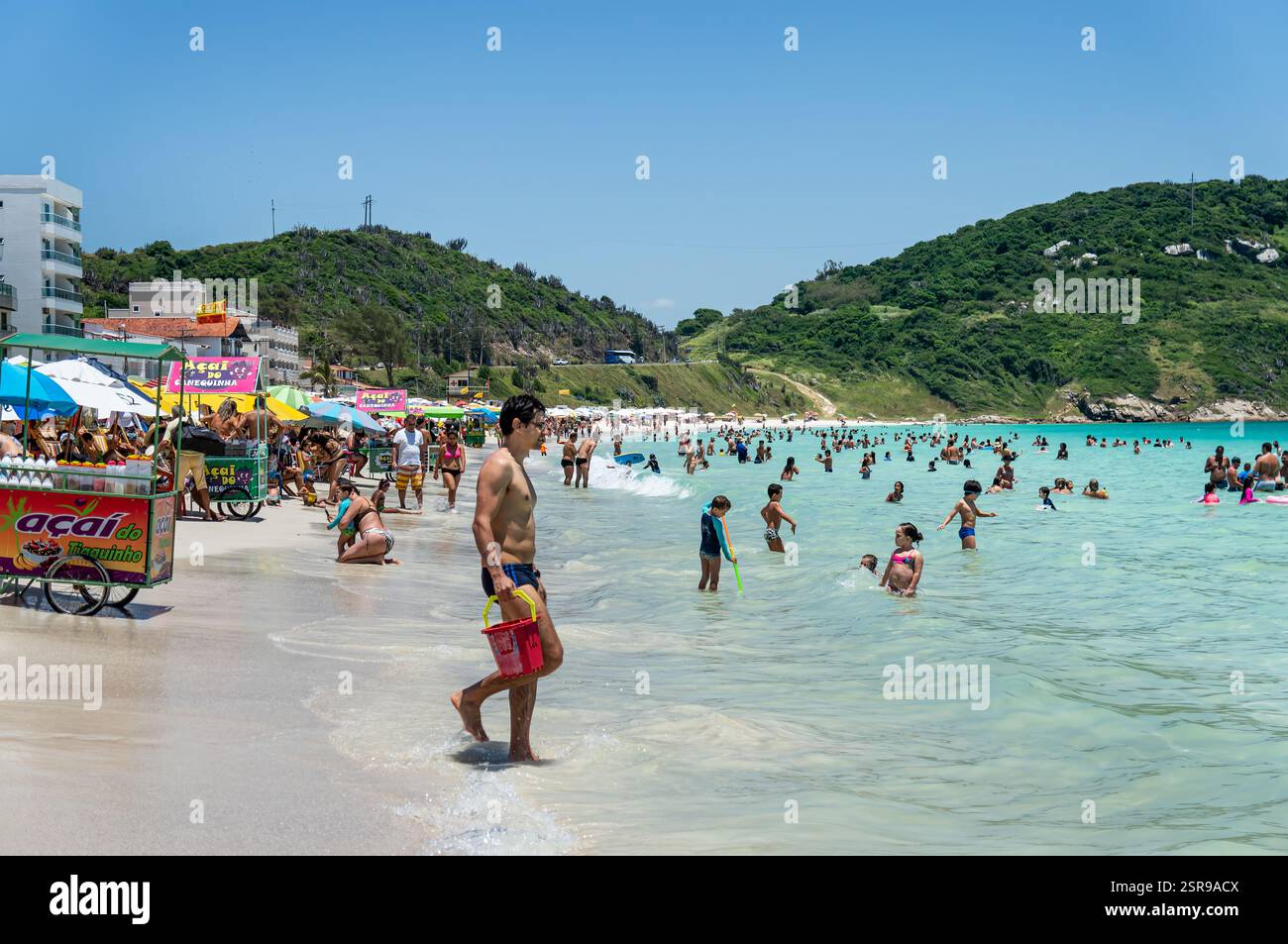 Vibrant afternoon at Prainha beach, with beachgoers enjoying crystal ...
