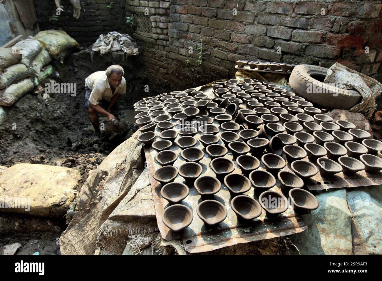 Potter with diyas for Diwali festival, Dharavi, Mumbai, Maharashtra ...