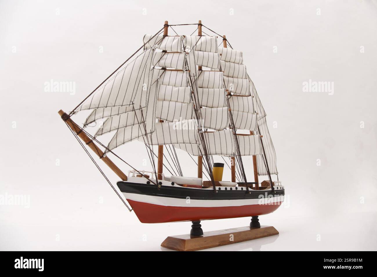 Miniature toy sailing boat on white background Stock Photo - Alamy