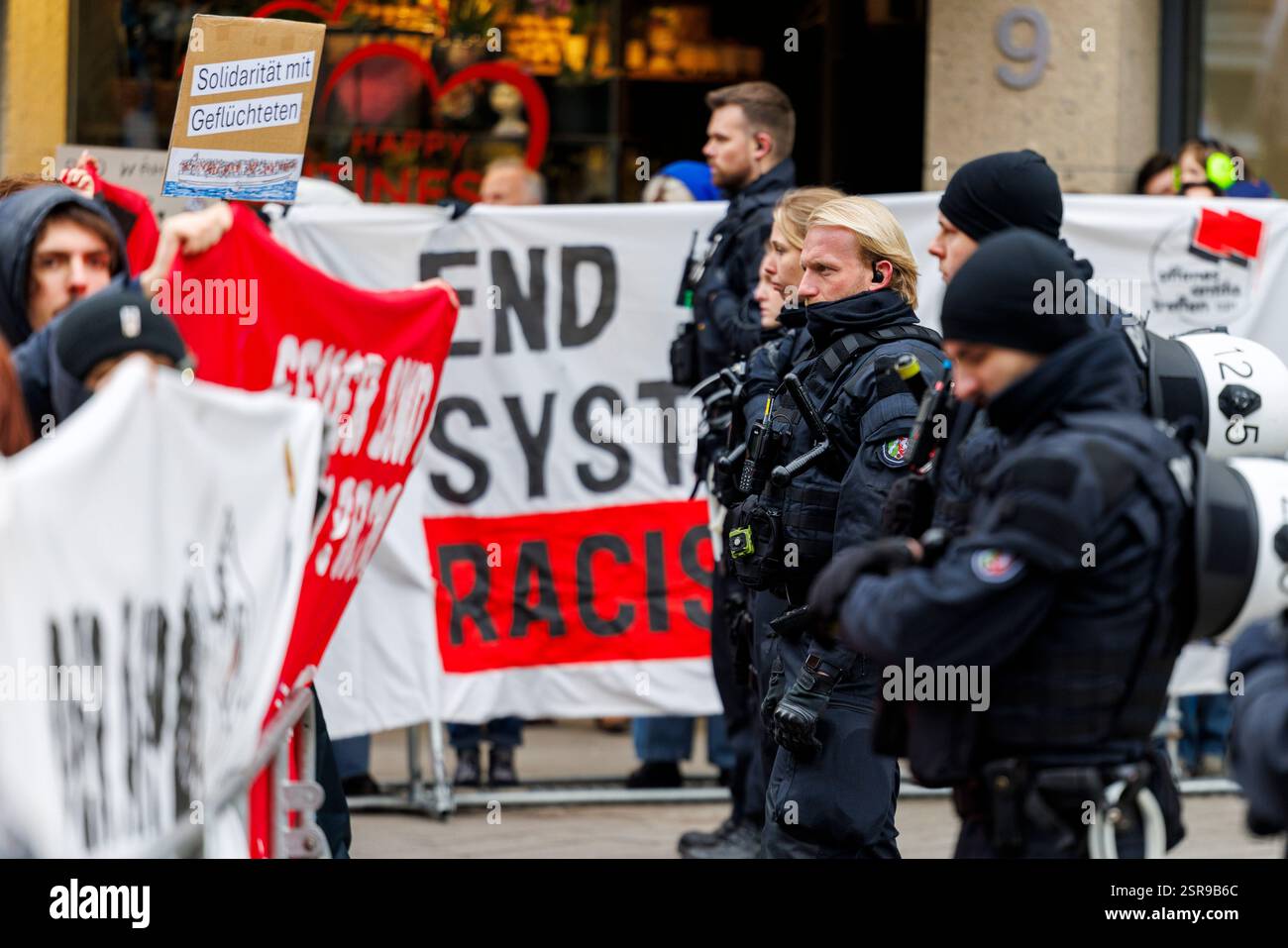 Duesseldorf, Germany. 15th Feb, 2025. Police officers stand opposite ...