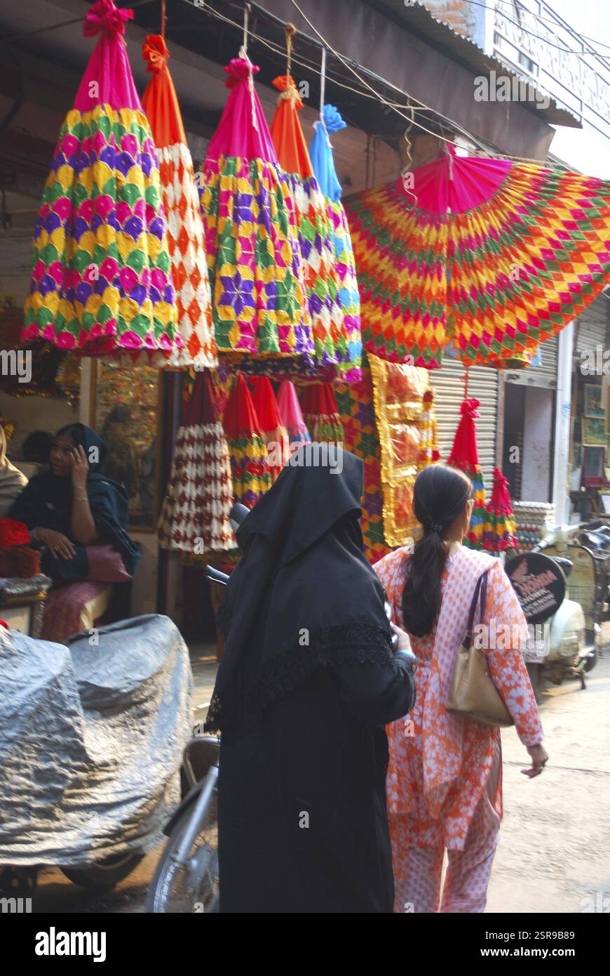 Lady in burkha in market lane of old Lucknow, Uttar Pradesh, India ...