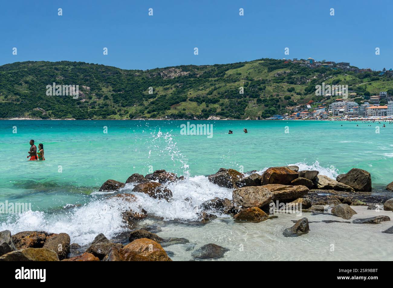 Waves splashing on rocks at Prainha beach, with Atlantic Ocean blue ...