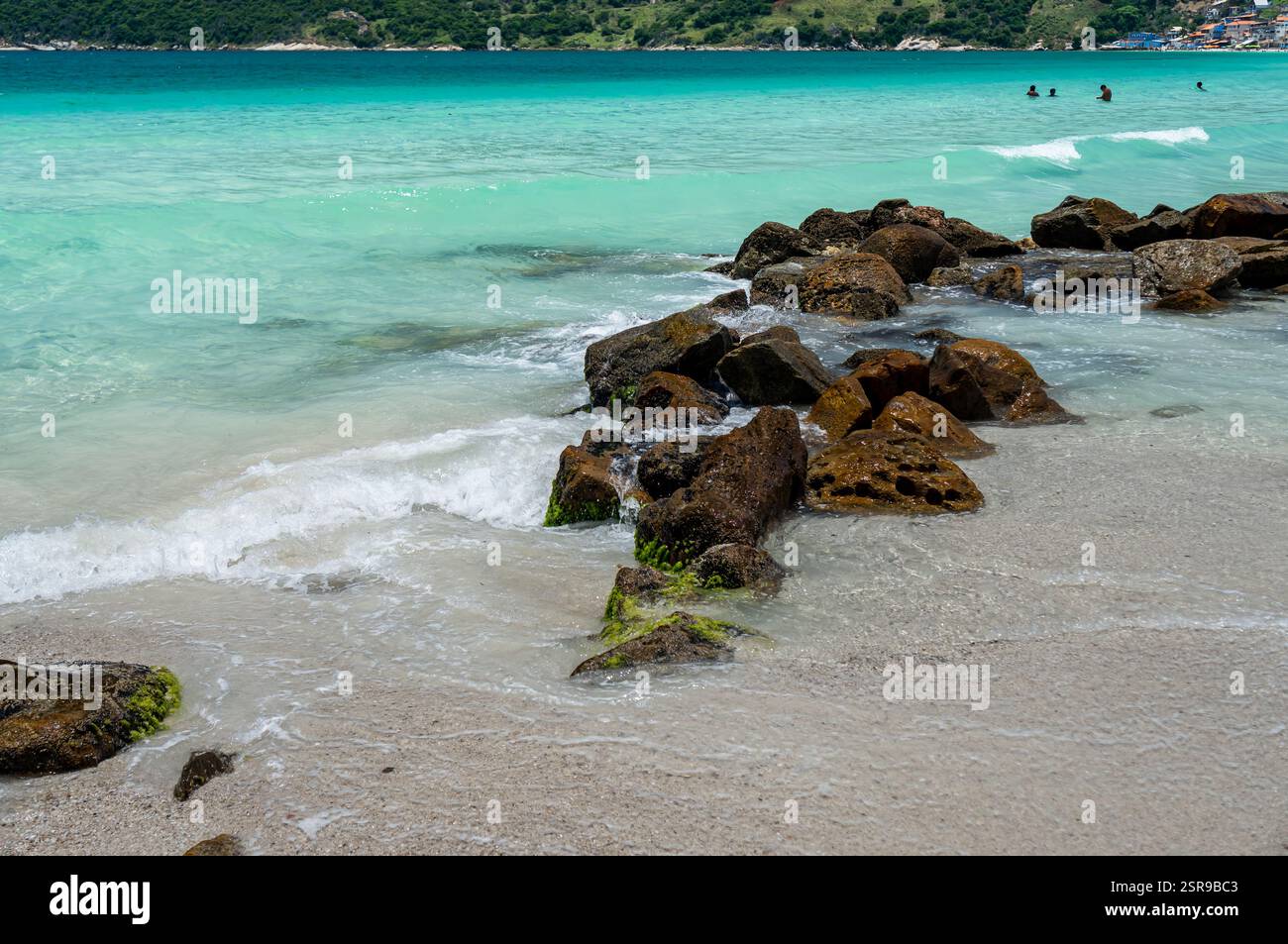 Rocky shoreline waves gently washing hi-res stock photography and ...