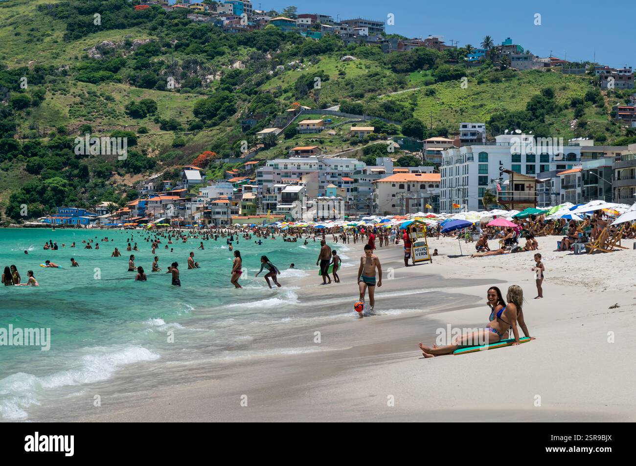 Crowded Prainha beach shoreline with many tourists enjoying the ...