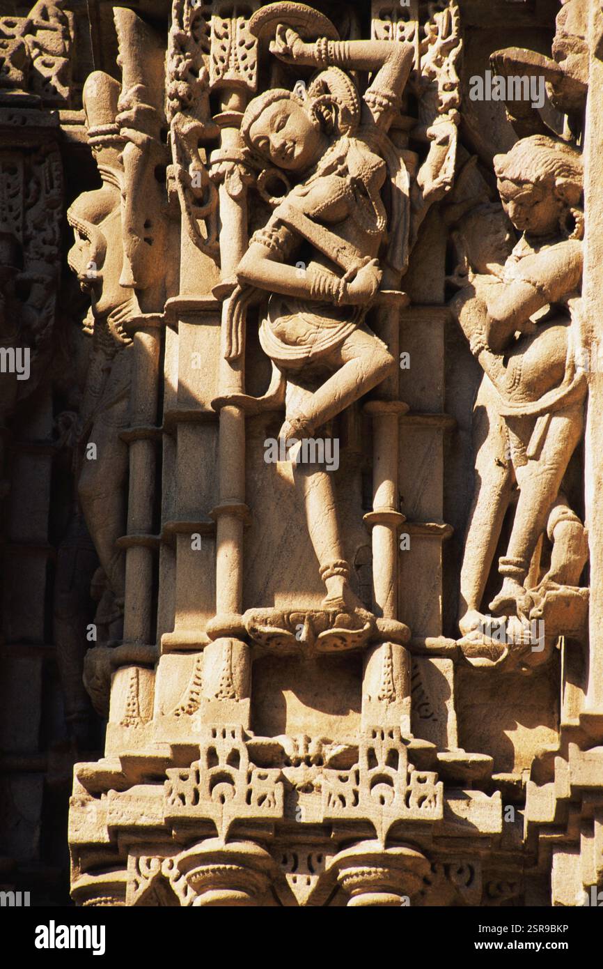 Delicately carved human figures on facade of Hatheesingh, Jain temple ...
