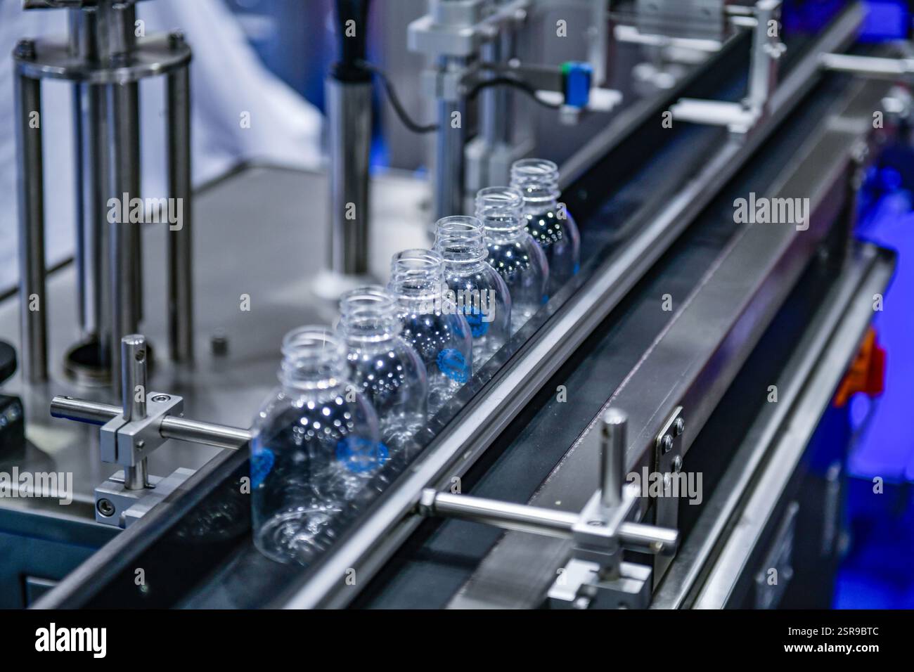 Clear plastic Bottles transfer on Automated conveyor systems industrial ...