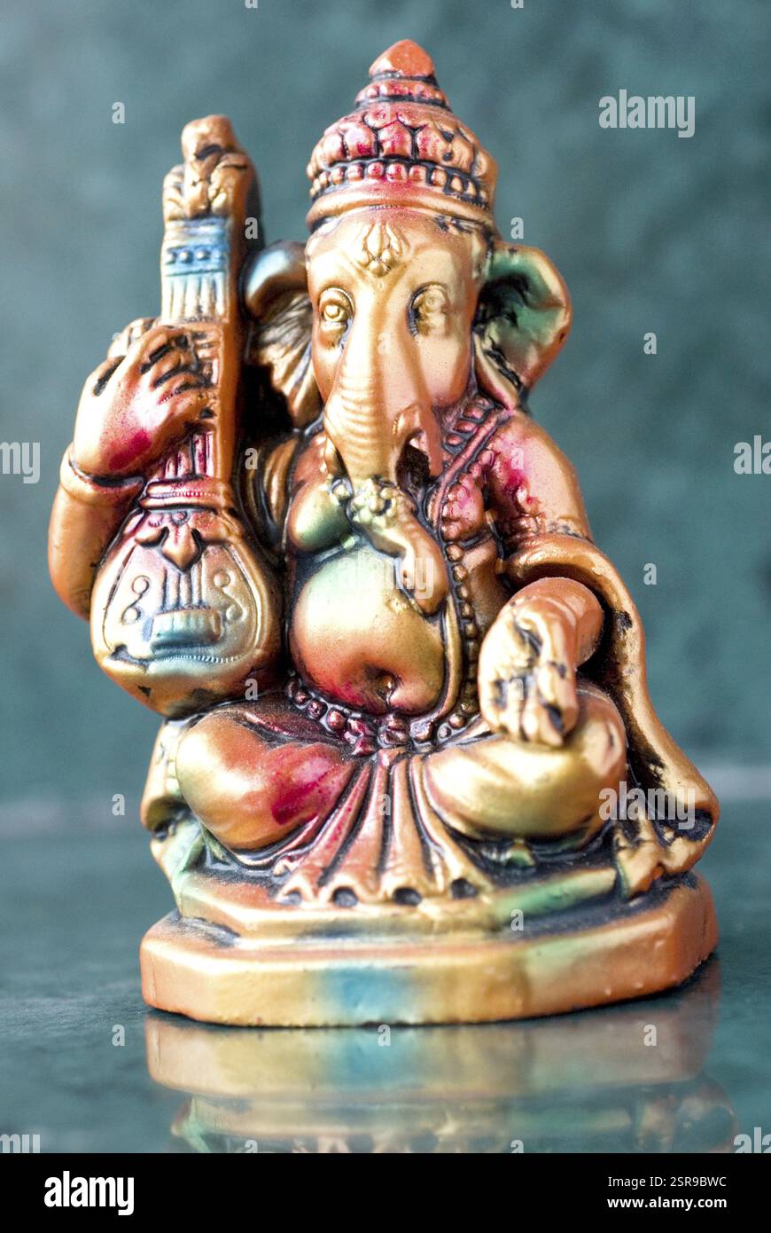 Lord Ganesha ganpati plaster Idol sitting colourful playing tanpura ...