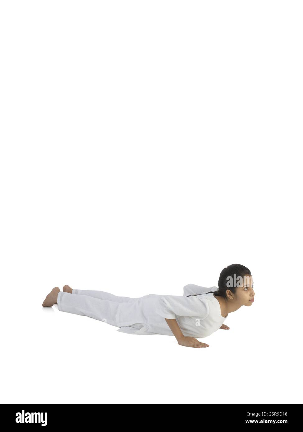Girl practicing bhujang asana MR#779J Stock Photo - Alamy