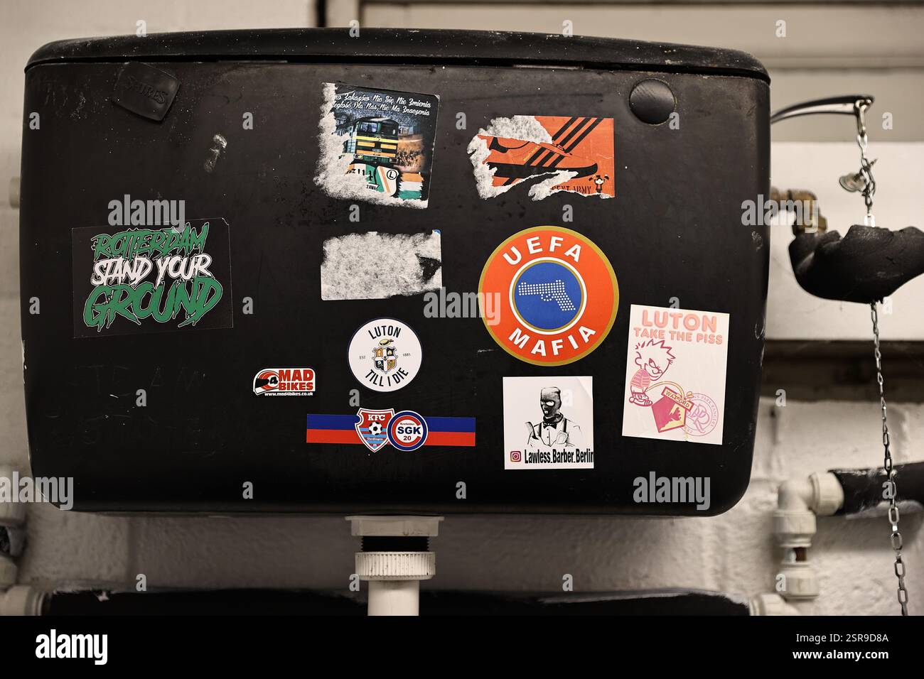 Luton, UK. 15th Feb, 2025. Football stickers are seen on a toilet ...