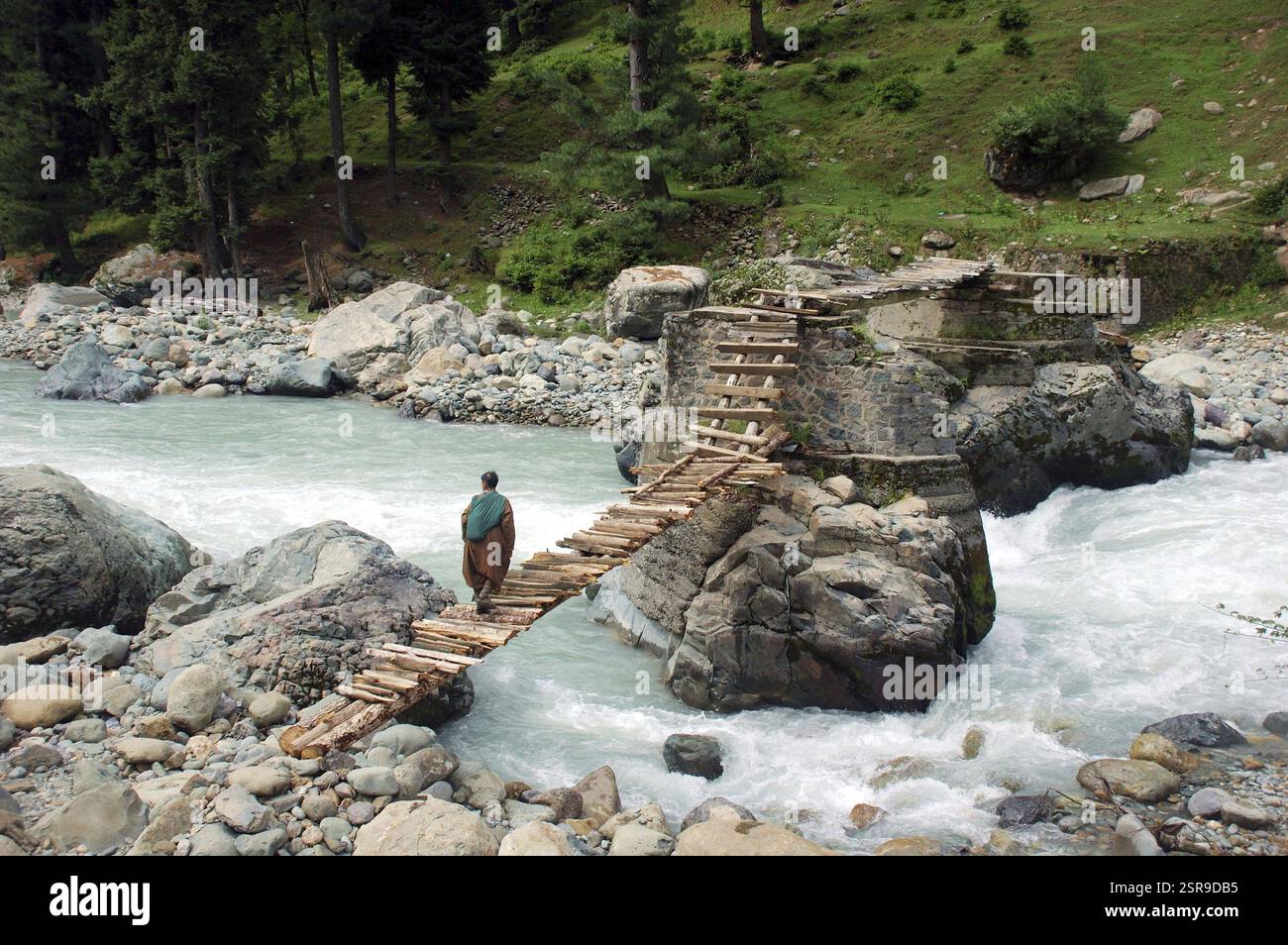 A man crossing a bridge, Pahalgam, Jammu & Kashmir, India, Asia Stock ...