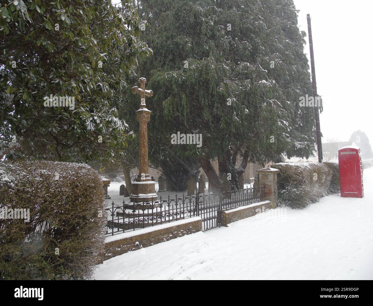 The cross in the churchyard of St. John the Evangelist in Tatworth ...