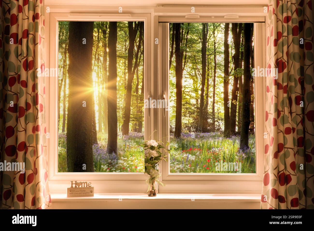 Looking through closed window to beautiful flower forest landscape ...