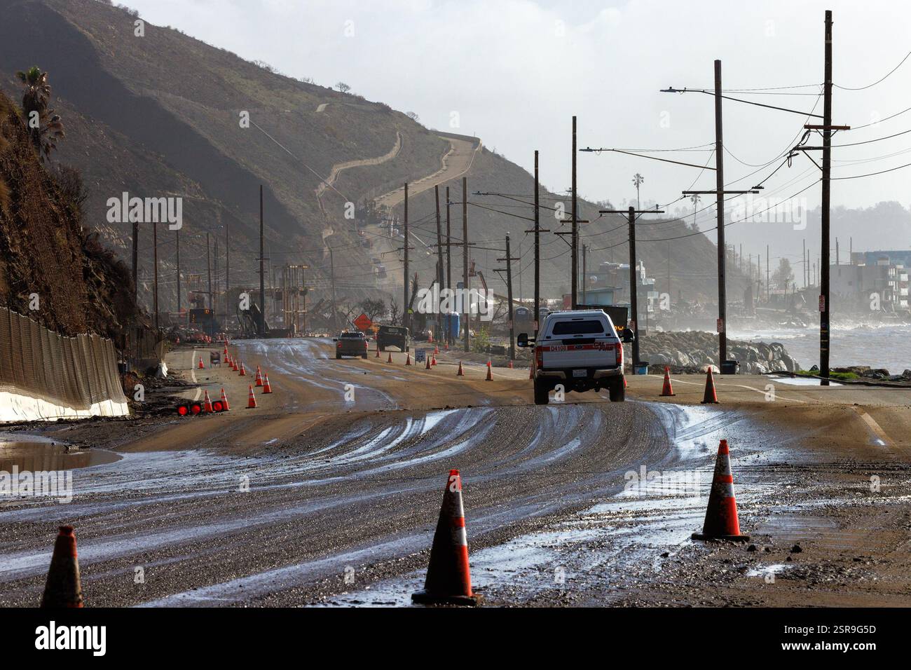 Malibu, California, USA. 14th Feb, 2025. Crews work on cleaning up from ...