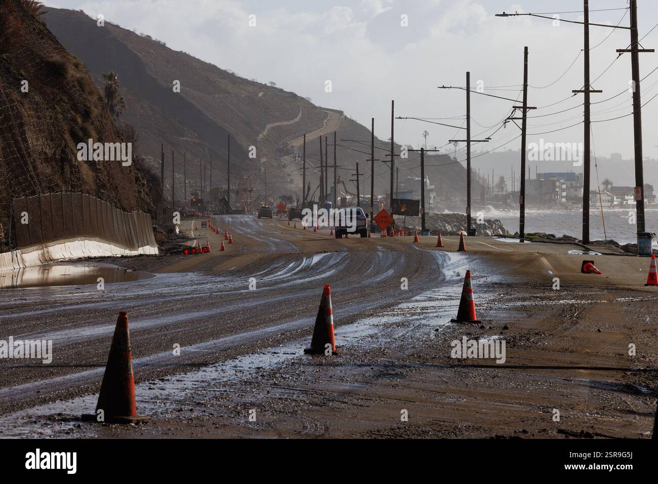 Malibu, California, USA. 14th Feb, 2025. Crews work on cleaning up from ...
