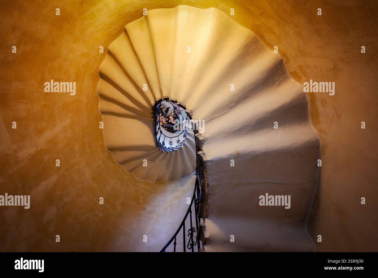 Udine, Italy. Antique Italian spiral staircase with a classic fresco in ...
