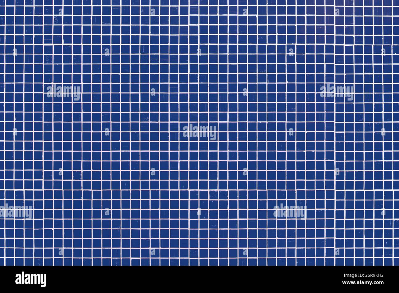 Blue glass mosaic tiles on white mortar. Texture background, real photo ...