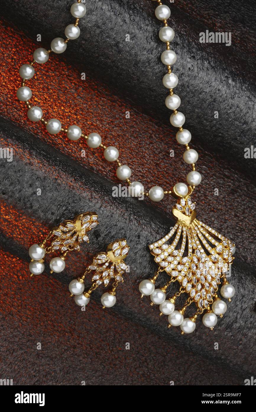 Diamond gold jewellery necklace with diamonds and pearls ear tops on ...
